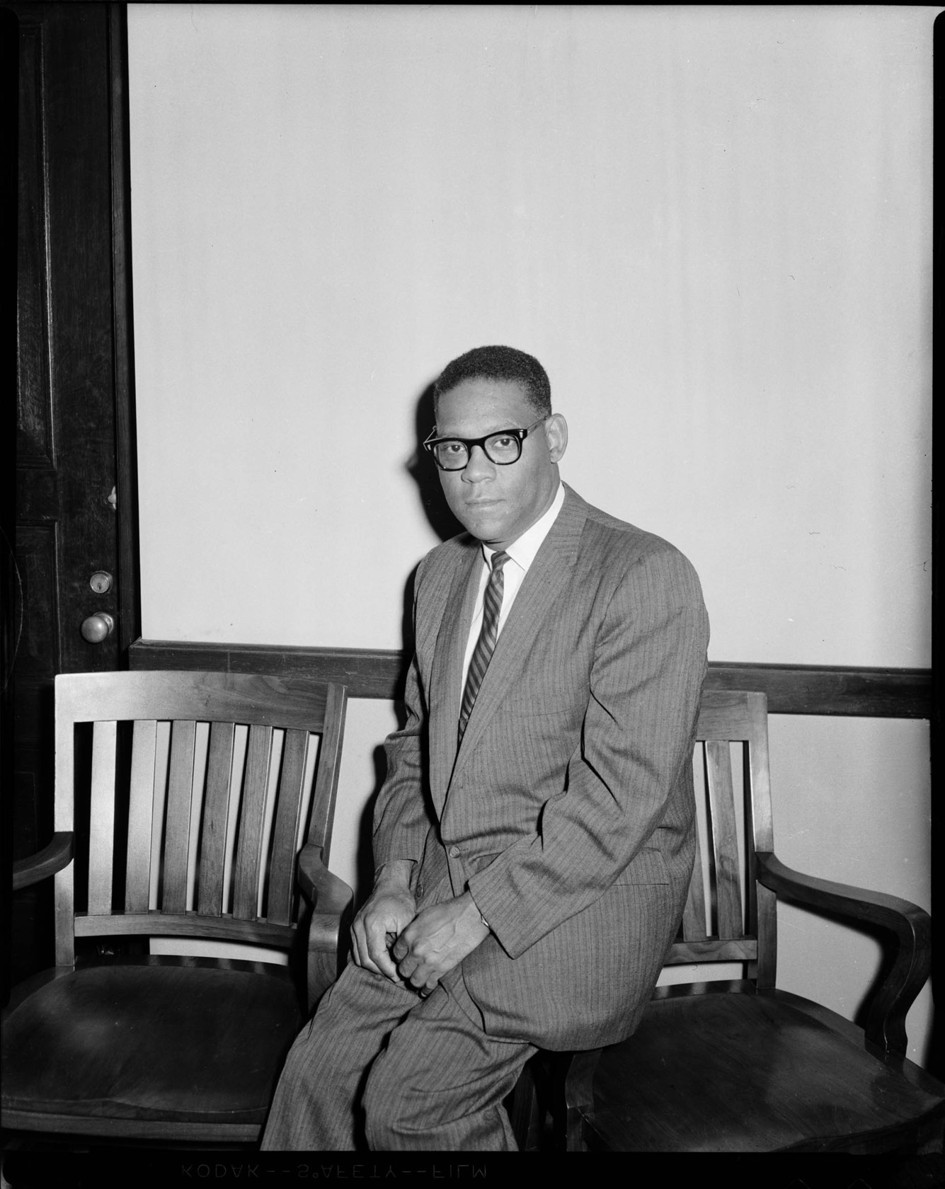 Portrait of K. Leroy Irvis wearing a striped suit and striped tie ...