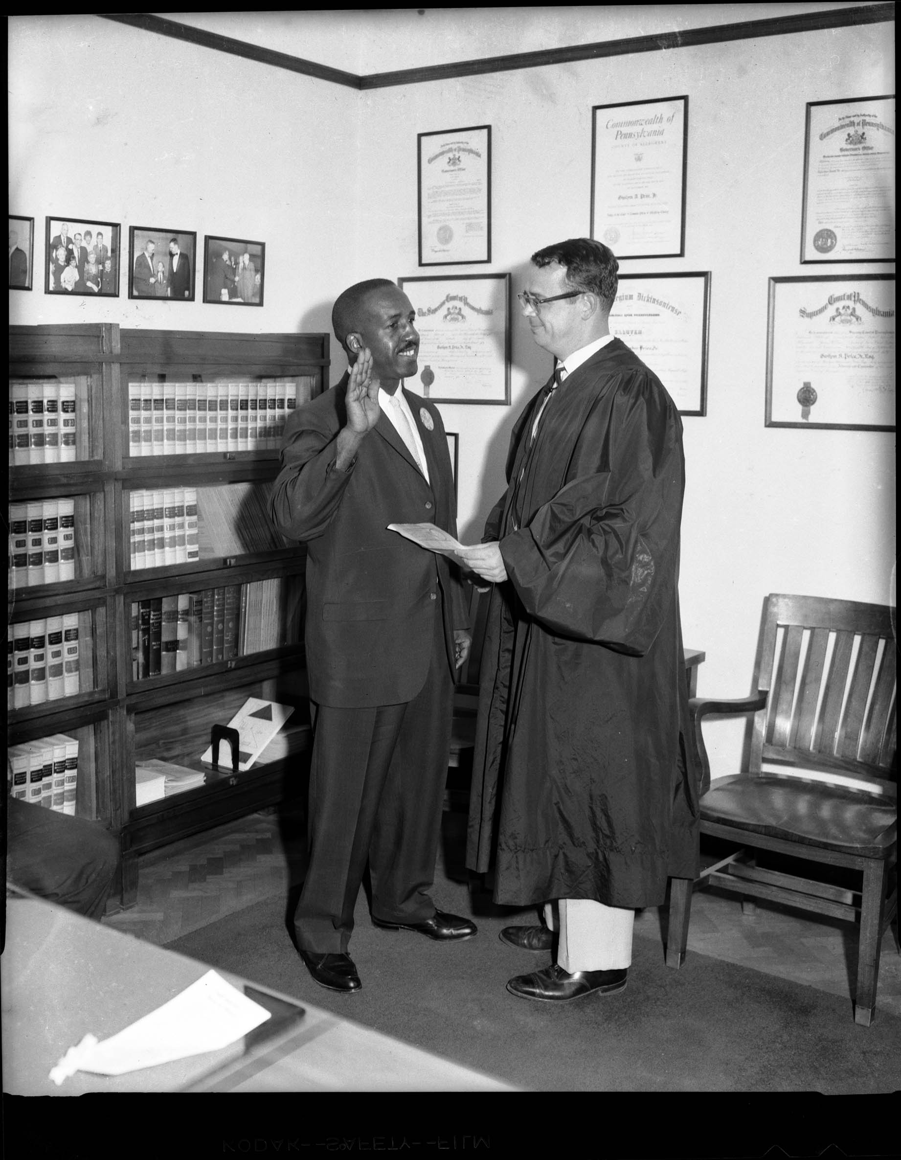 Judge swearing in John Adams, in office with bookcases and framed ...