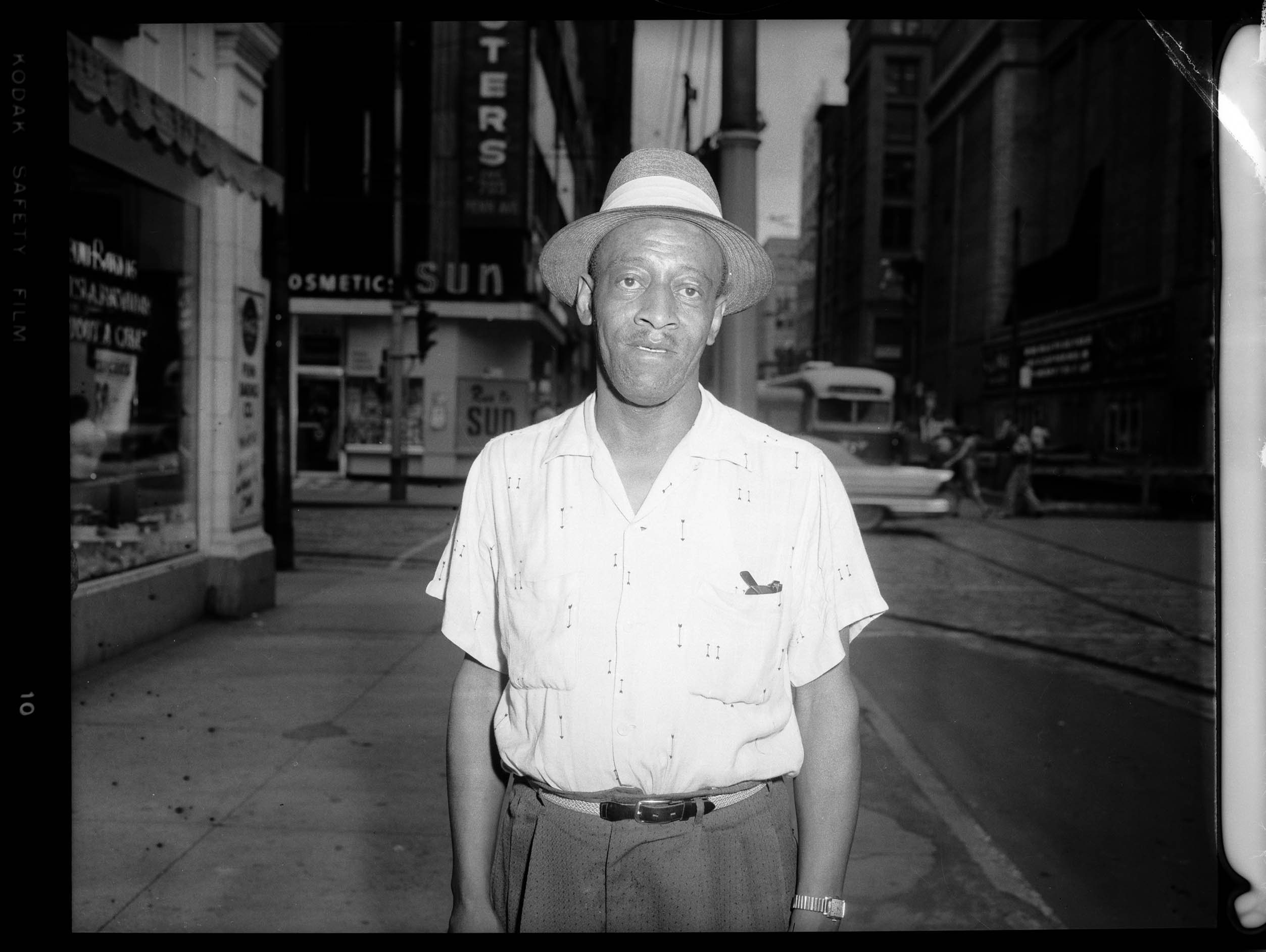Portrait of George Hamilton wearing straw hat with light colored band ...