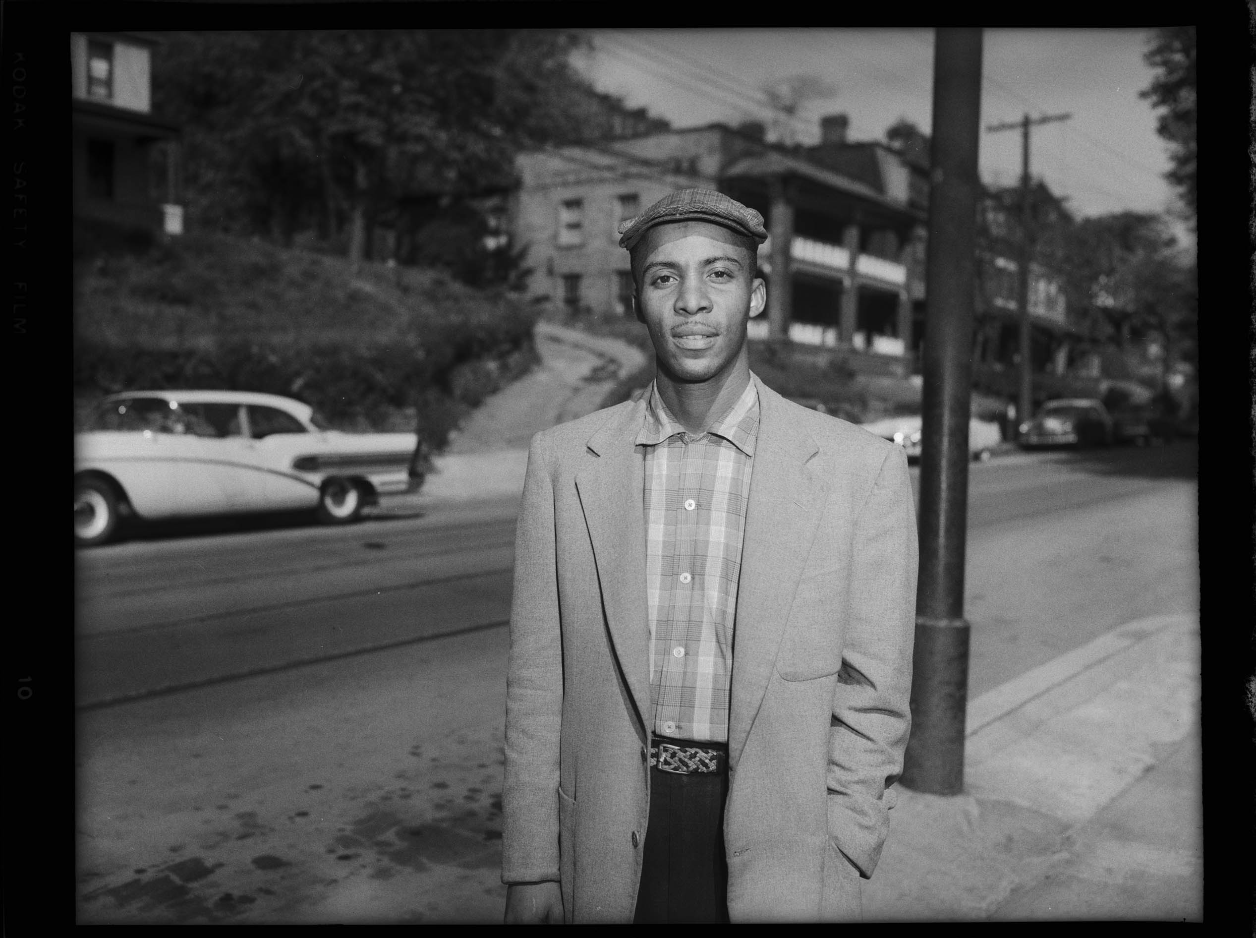Portrait of Bill Eggins wearing plaid hat, pencil moustache, and plaid ...